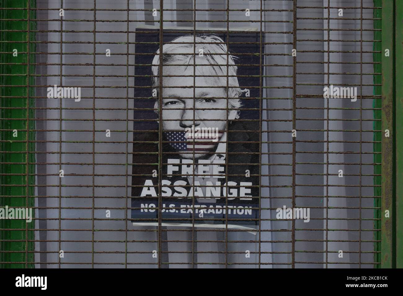 Free Assange poster seen in a window of a closed shop in Dublin city ...