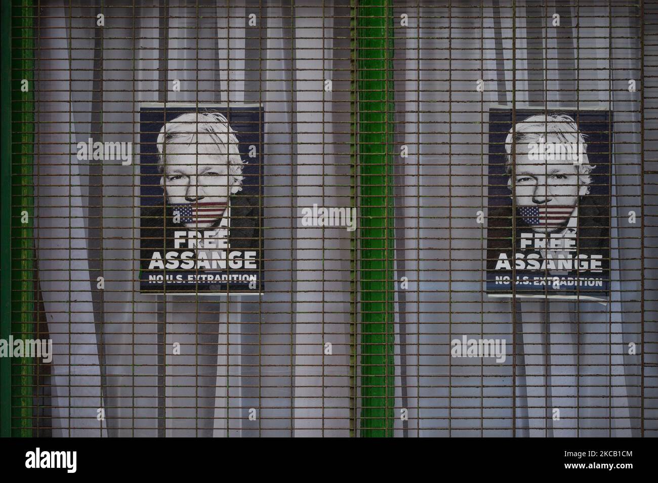 Free Assange posters seen in a window of a closed shop in Dublin city ...