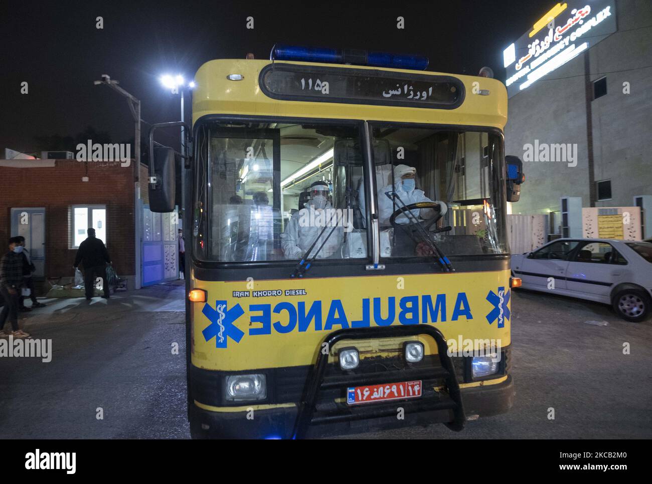 An Iranian medical personnel and a health assistant at an ambulance bus ...