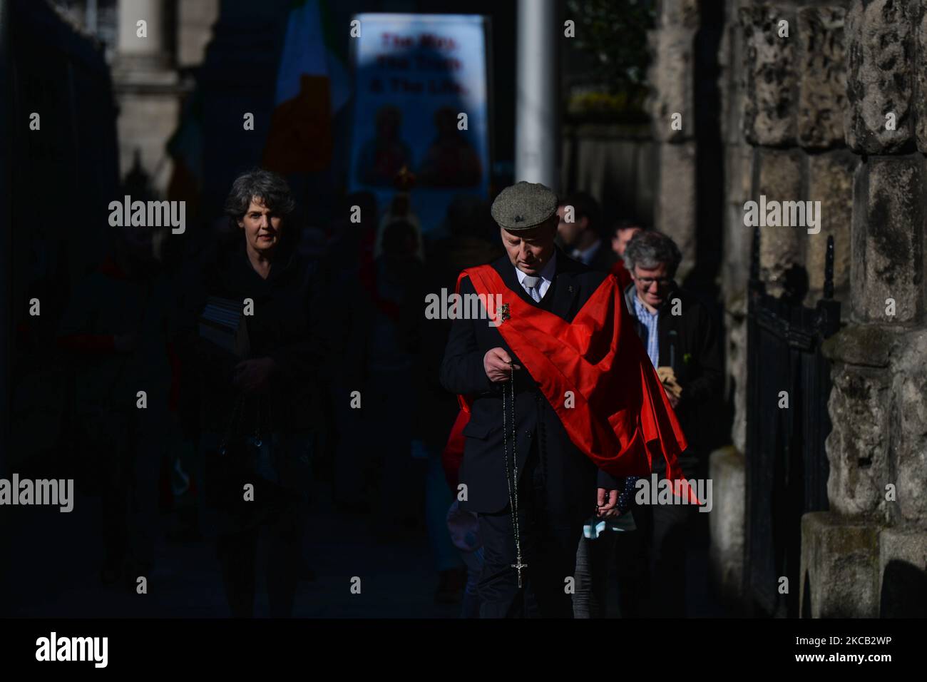 People take part in a religious procession through Dublin city center ...