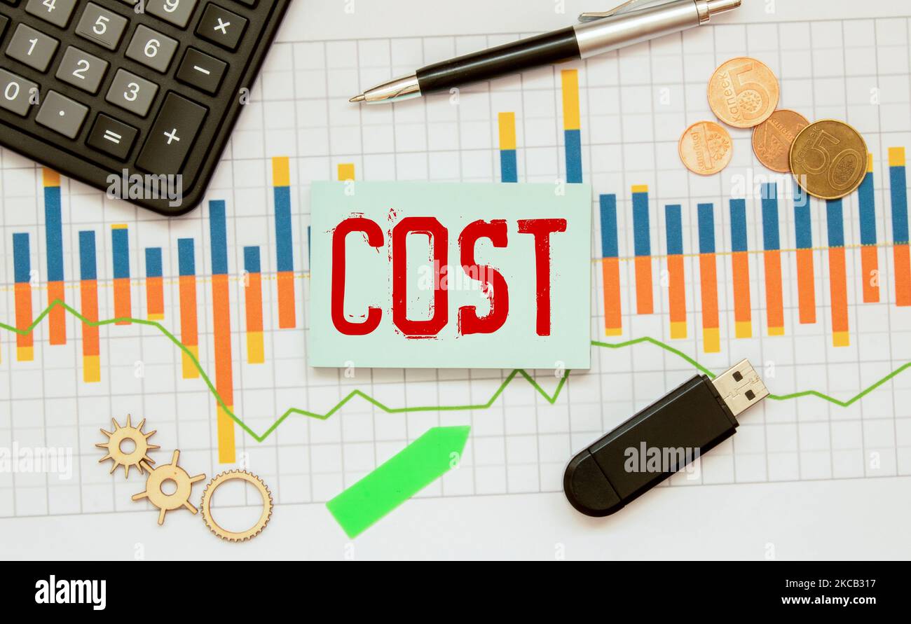 man hands cutting card with the word cost. business concept, cutting ...