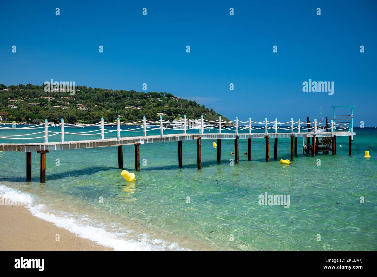 Wooden pier for guests of yachts on legendary Pampelonne beach near ...