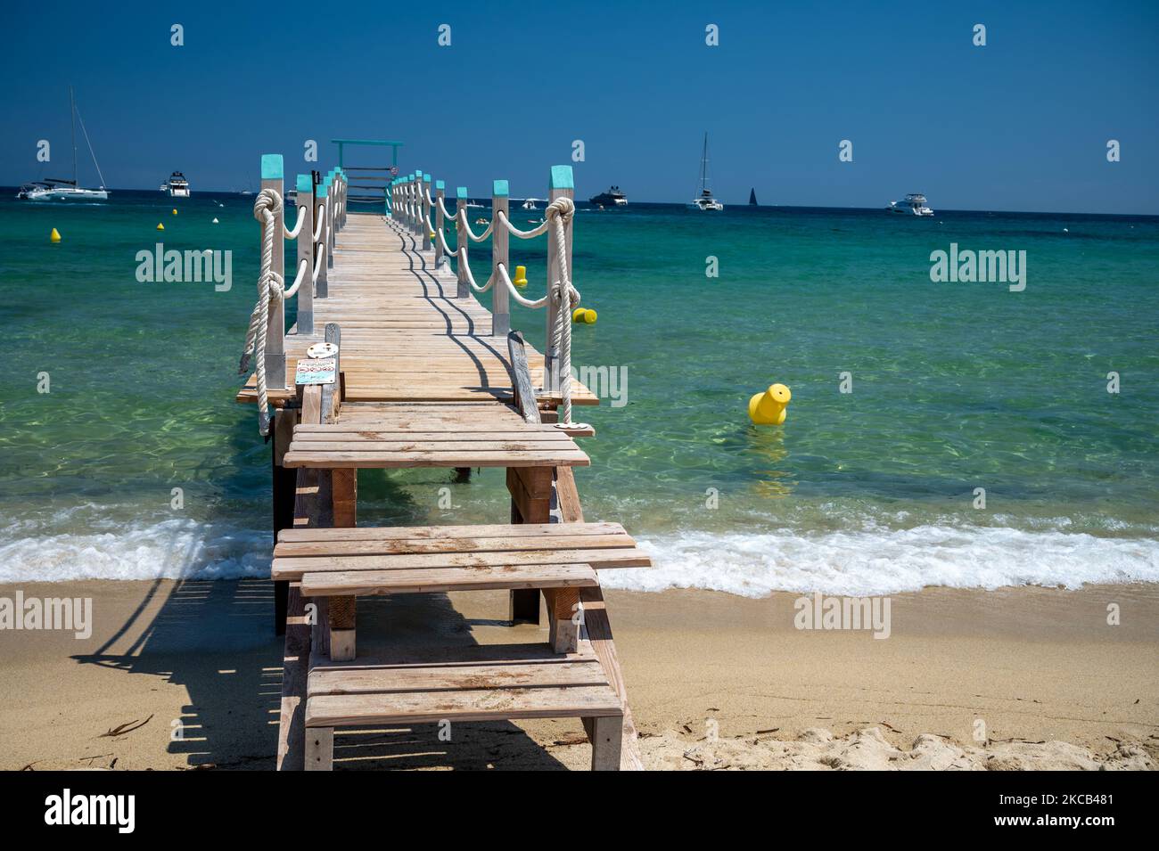 Wooden pier for guests of yachts on legendary Pampelonne beach near ...