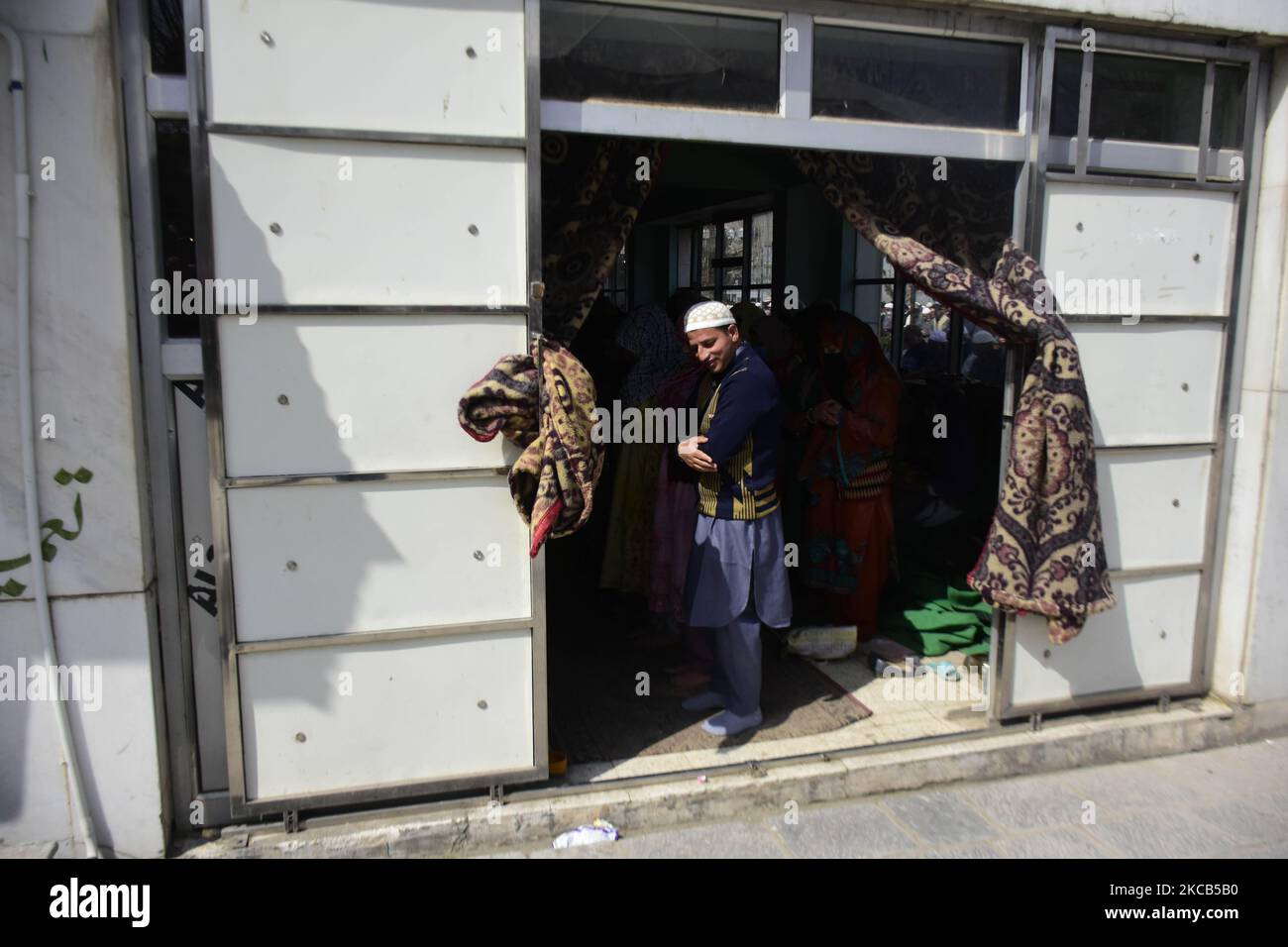 A Kashmiri man offer prayers at Hazratbal shrine on Friday following ...