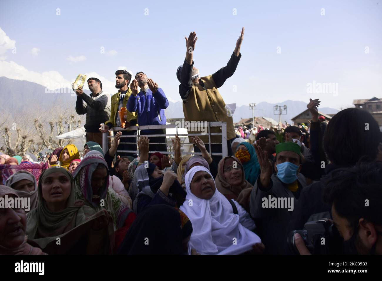 Kashmiri muslims offer prayers at Hazratbal shrine on Friday following ...
