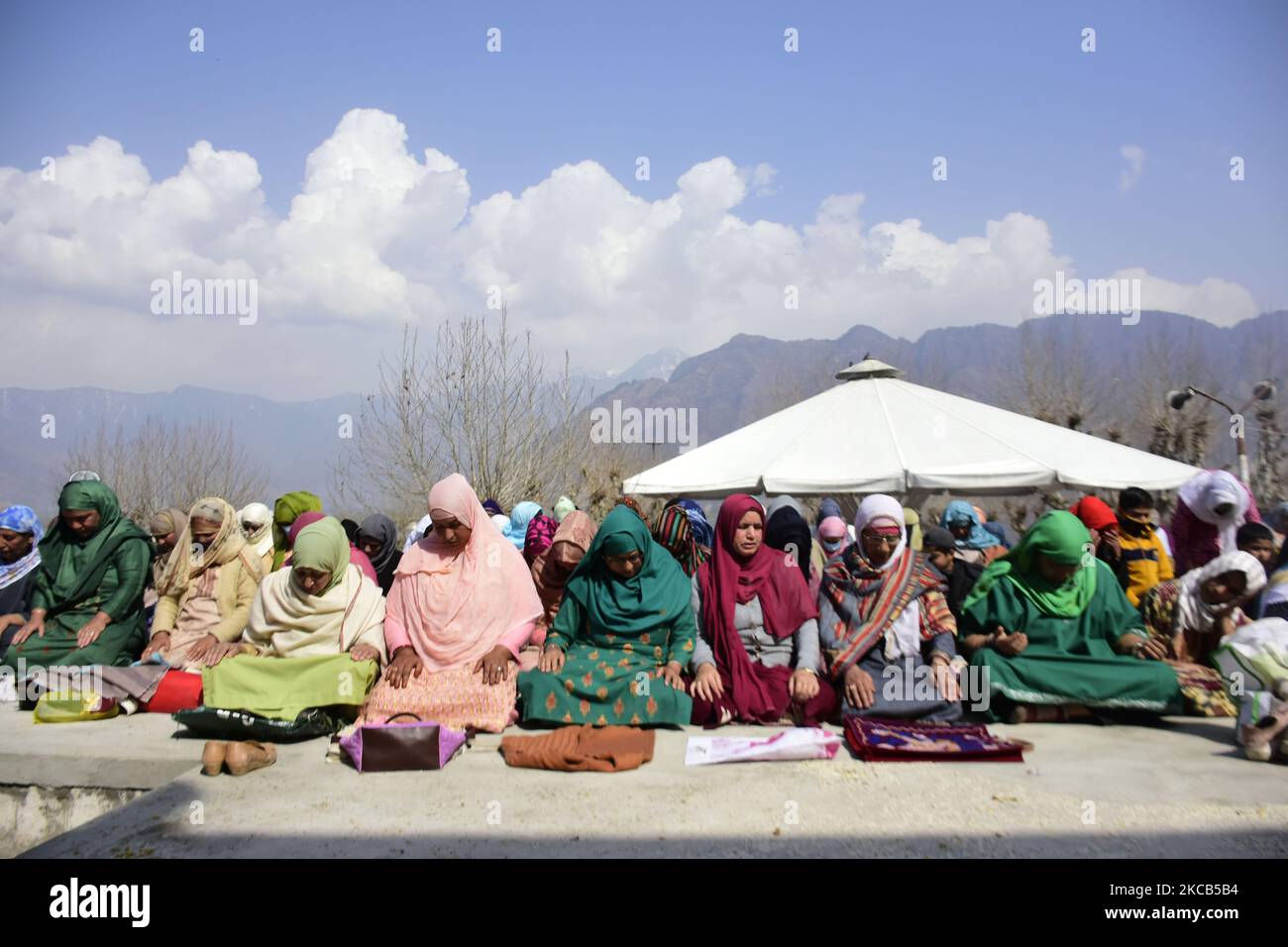 Kashmiri muslims offer prayers at Hazratbal shrine on Friday following ...