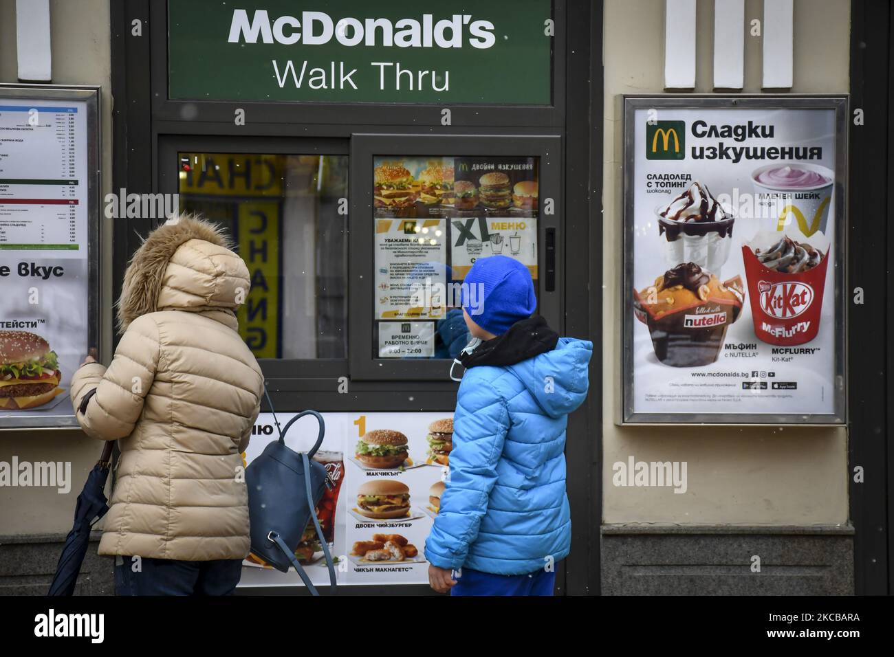 People buying lunch from walk thru window, after Bulgarian government ...
