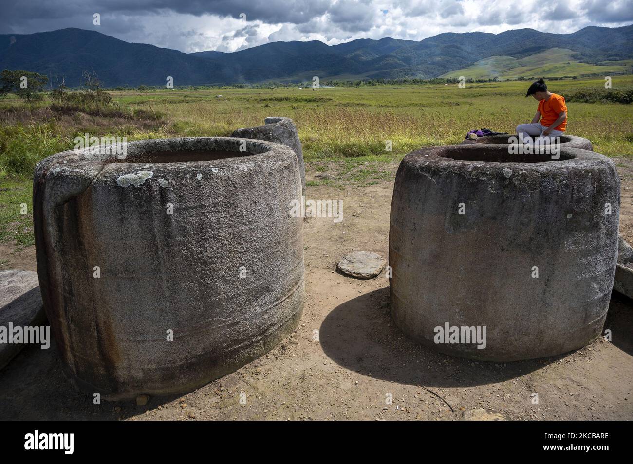 A tourist is on top of a stone vessel while visiting the Pokokea ...