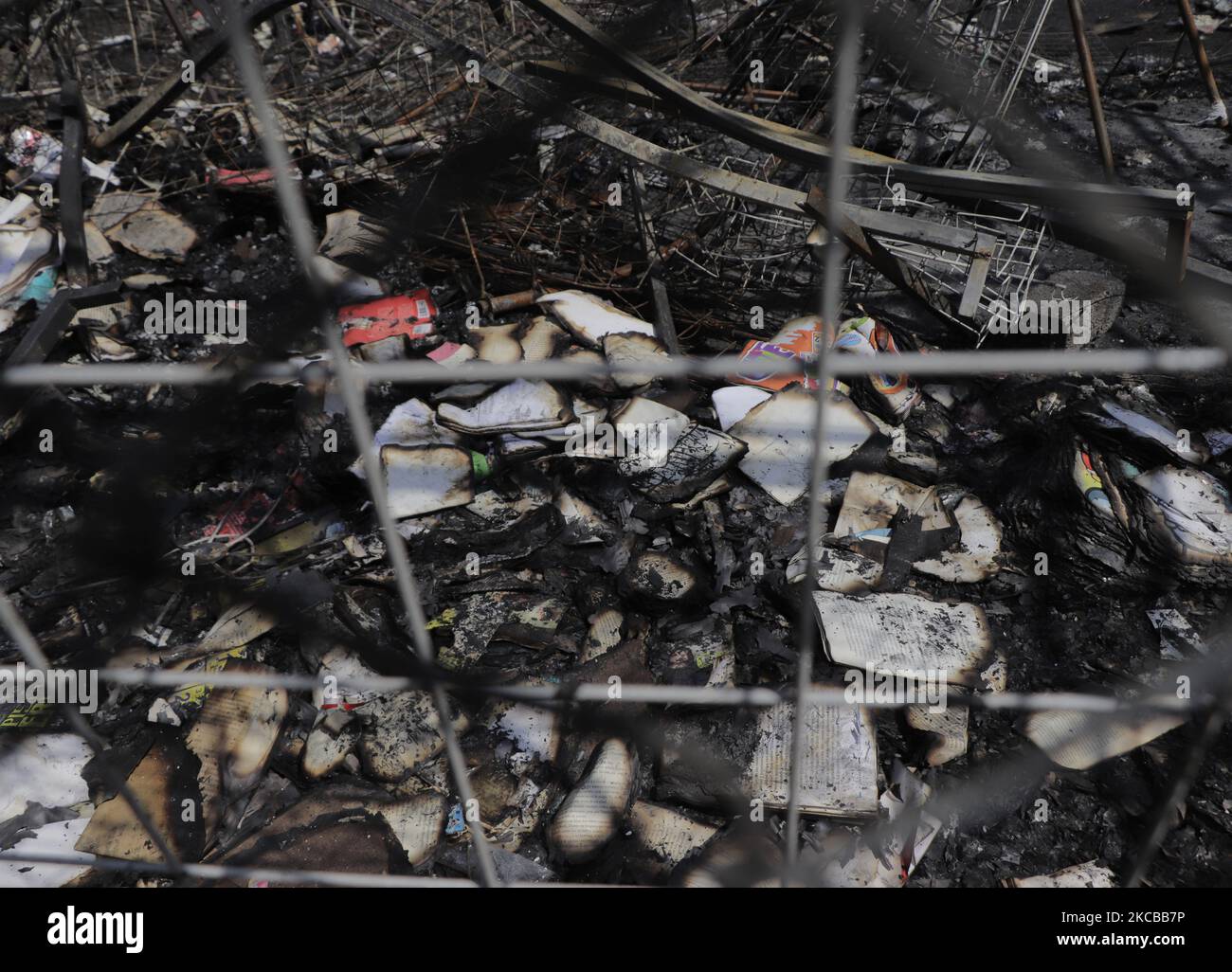 Charred material remains after a strong fire broke out at the San ...