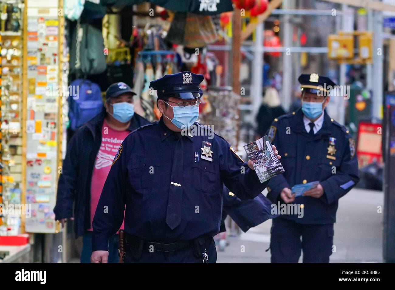 NYPD officers patrol Chinatown following the deadly spa killing of 8 ...
