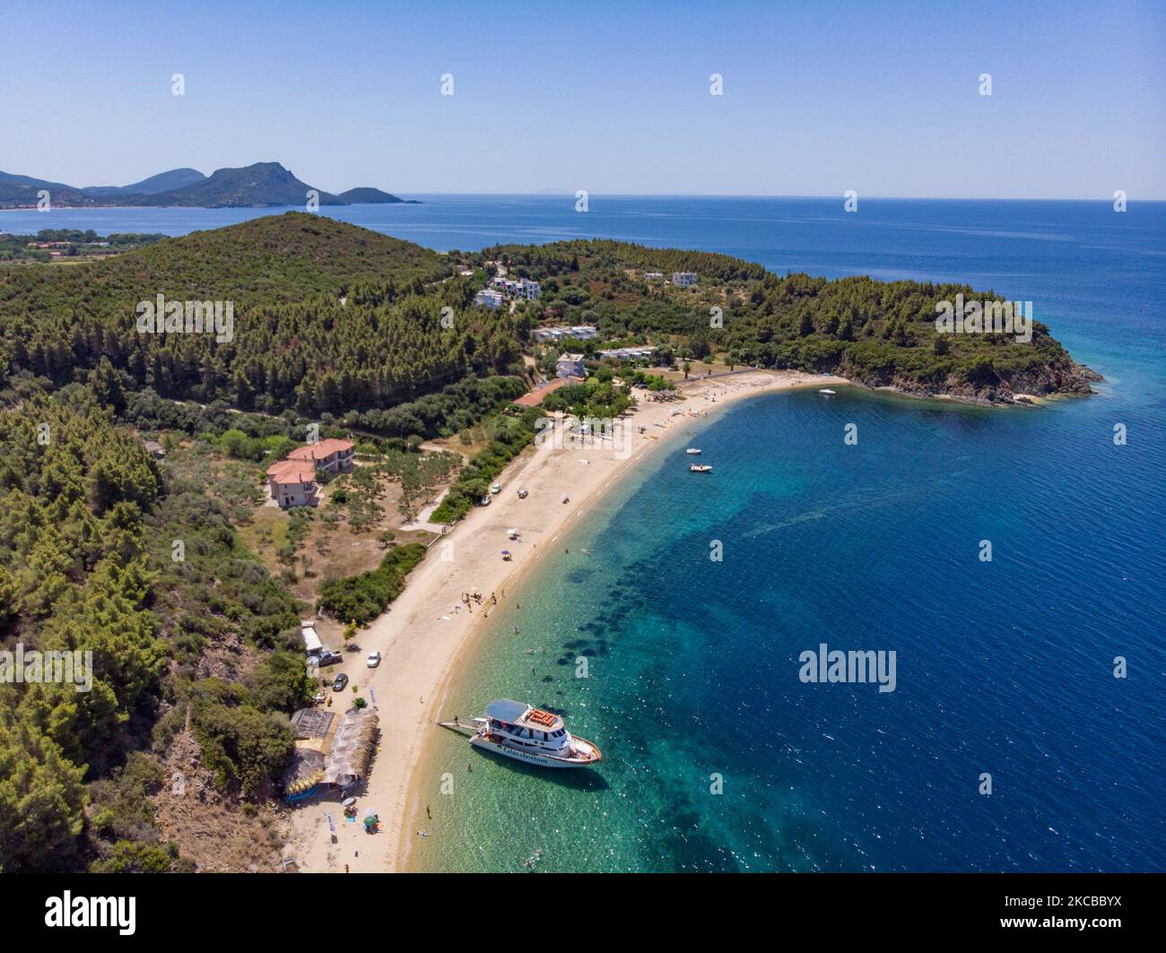Aerial bird's eye panoramic view from a drone of Aretes beach, in ...