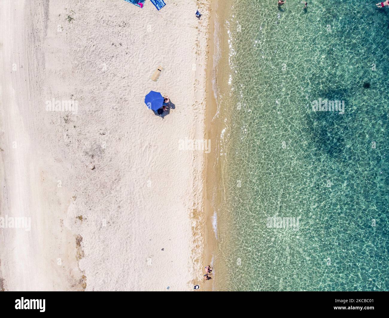Aerial bird's eye panoramic view from a drone of Aretes beach, in ...