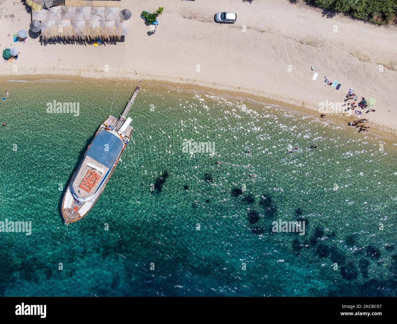 Aerial bird's eye panoramic view from a drone of Aretes beach, in ...