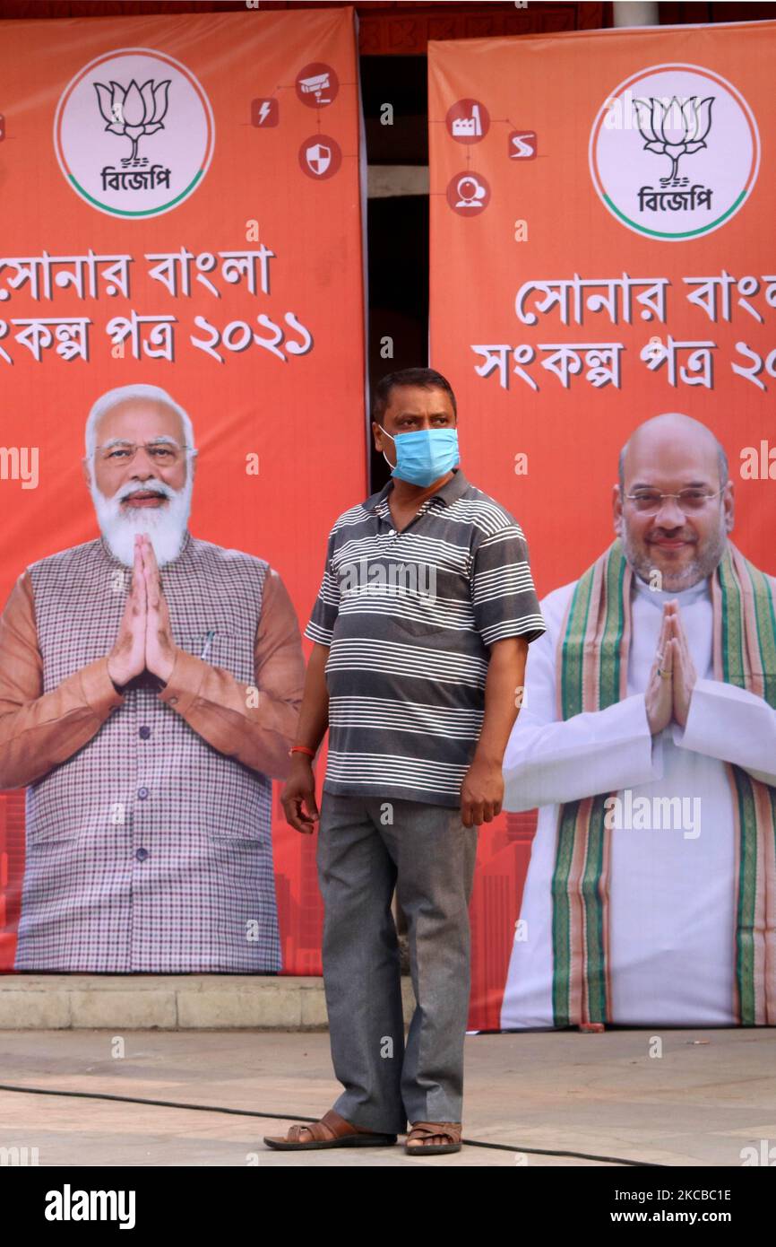 A Man warring protective face mask stand in front of India Prime ...