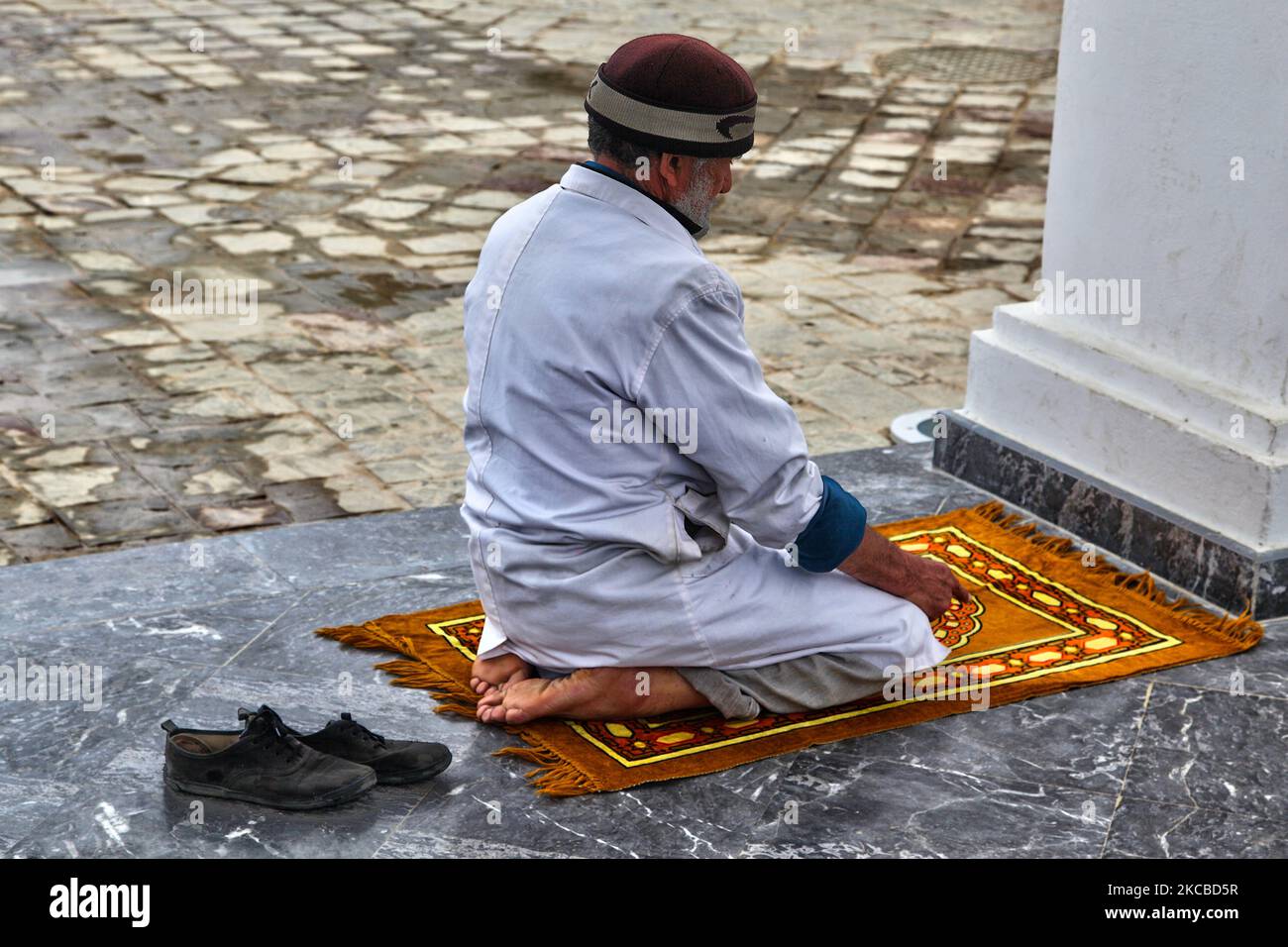 Muslim man praying by the Caves of Hercules (Grottes d'Hercule) in ...