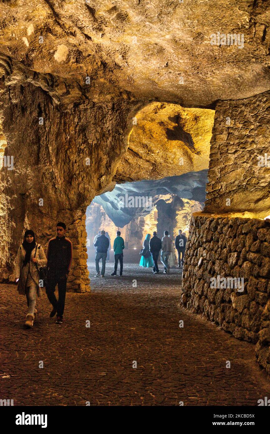 Arab tourists walk through the Caves of Hercules (Grottes d'Hercule) in ...