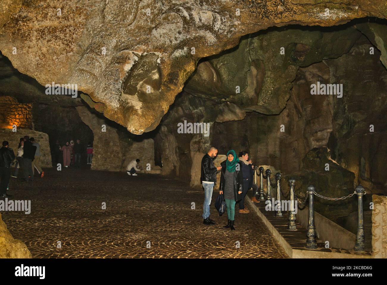 Arab tourists walk through the Caves of Hercules (Grottes d'Hercule) in ...