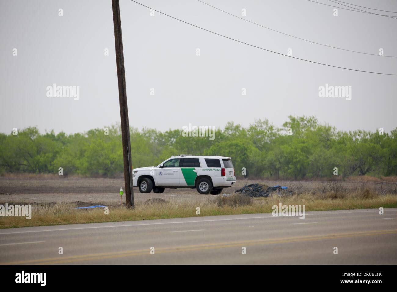 A border patrol car sits next to the border wall in Donna, Texas on ...