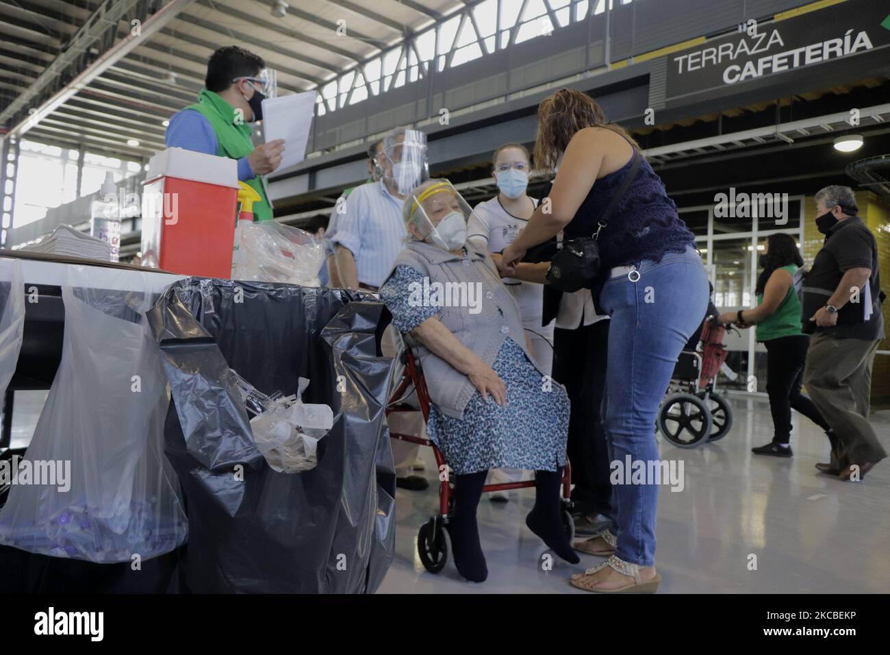 Medical personnel immunize senior citizens with the Pfizer-BioNTech ...