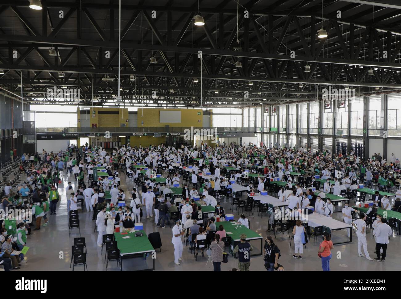 Medical personnel immunize senior citizens with the Pfizer-BioNTech ...