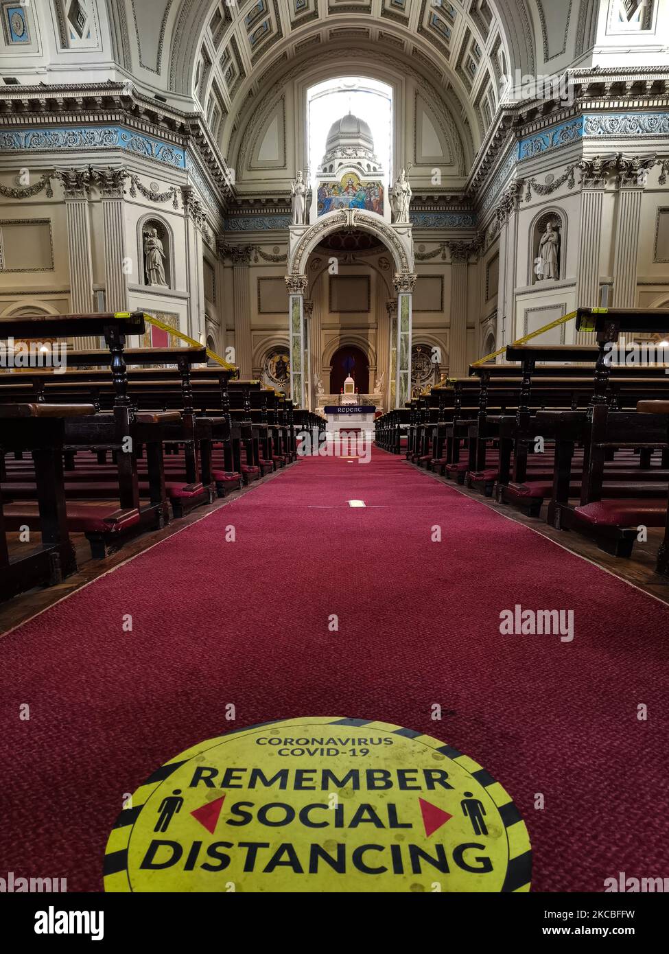 A sign reading 'Remember Social Distancing' seen inside Mary Immaculate ...