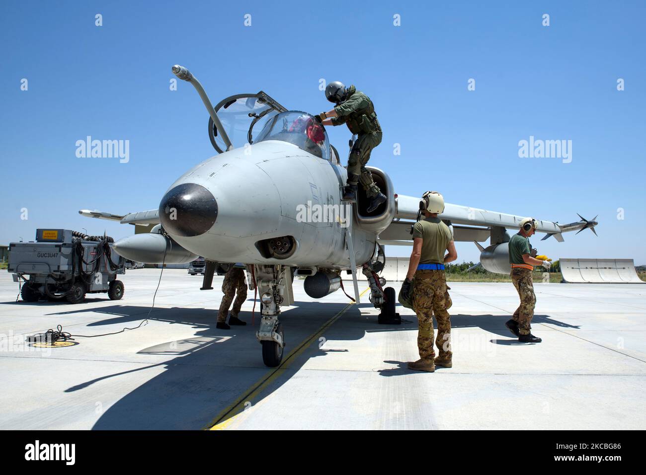 Pilot climbing into the cockpit of an Italian Air Force AMX aircraft ...