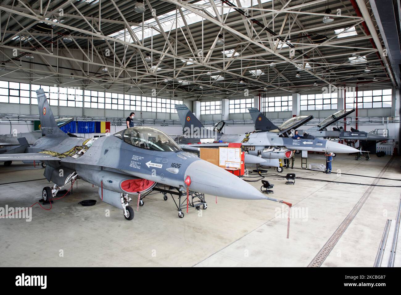 Romanian Air Force F-16's inside the maintenance hangar at an airbase ...