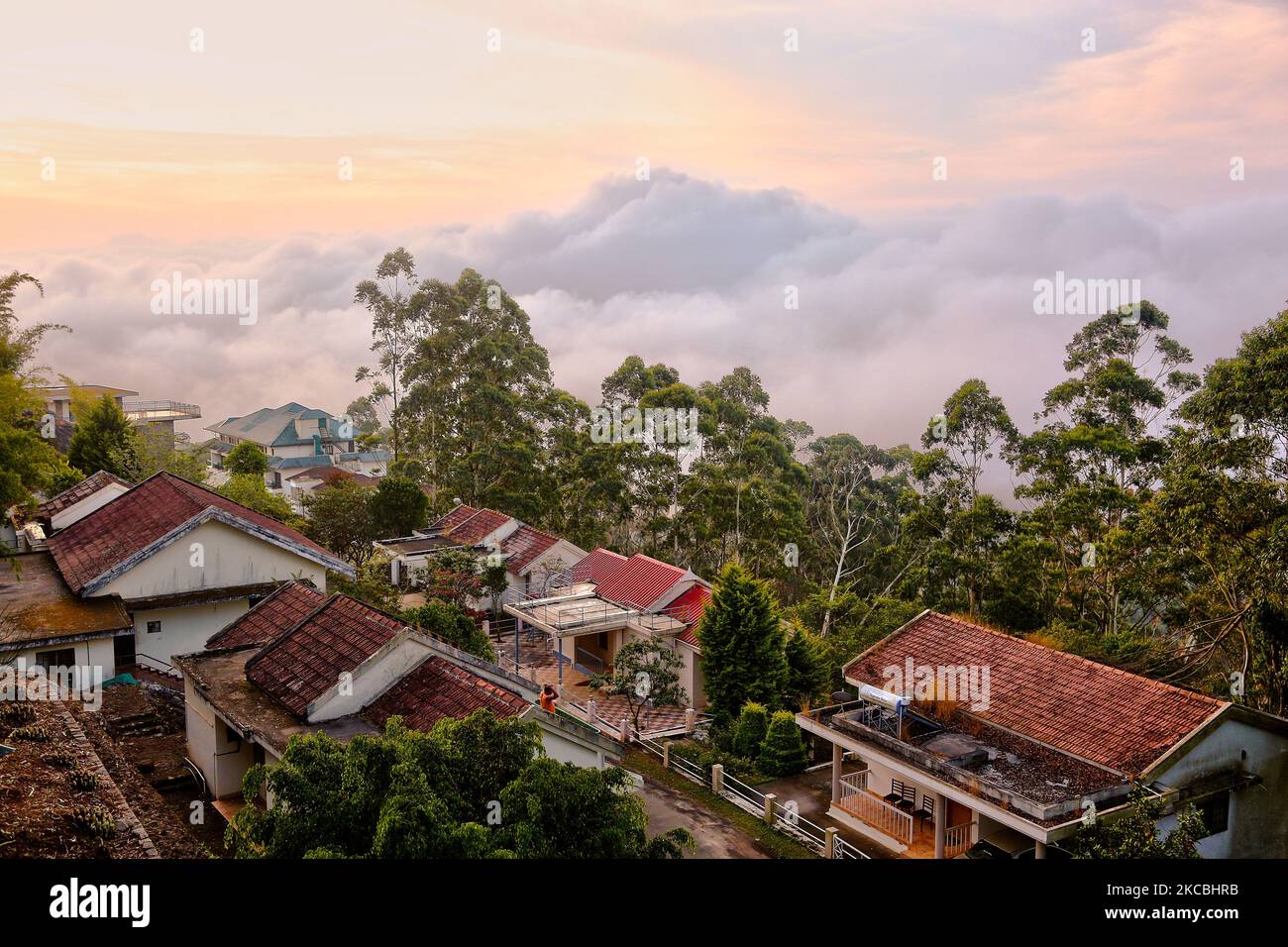 Sunrise seen with guest houses in the foreground high in the mountains ...