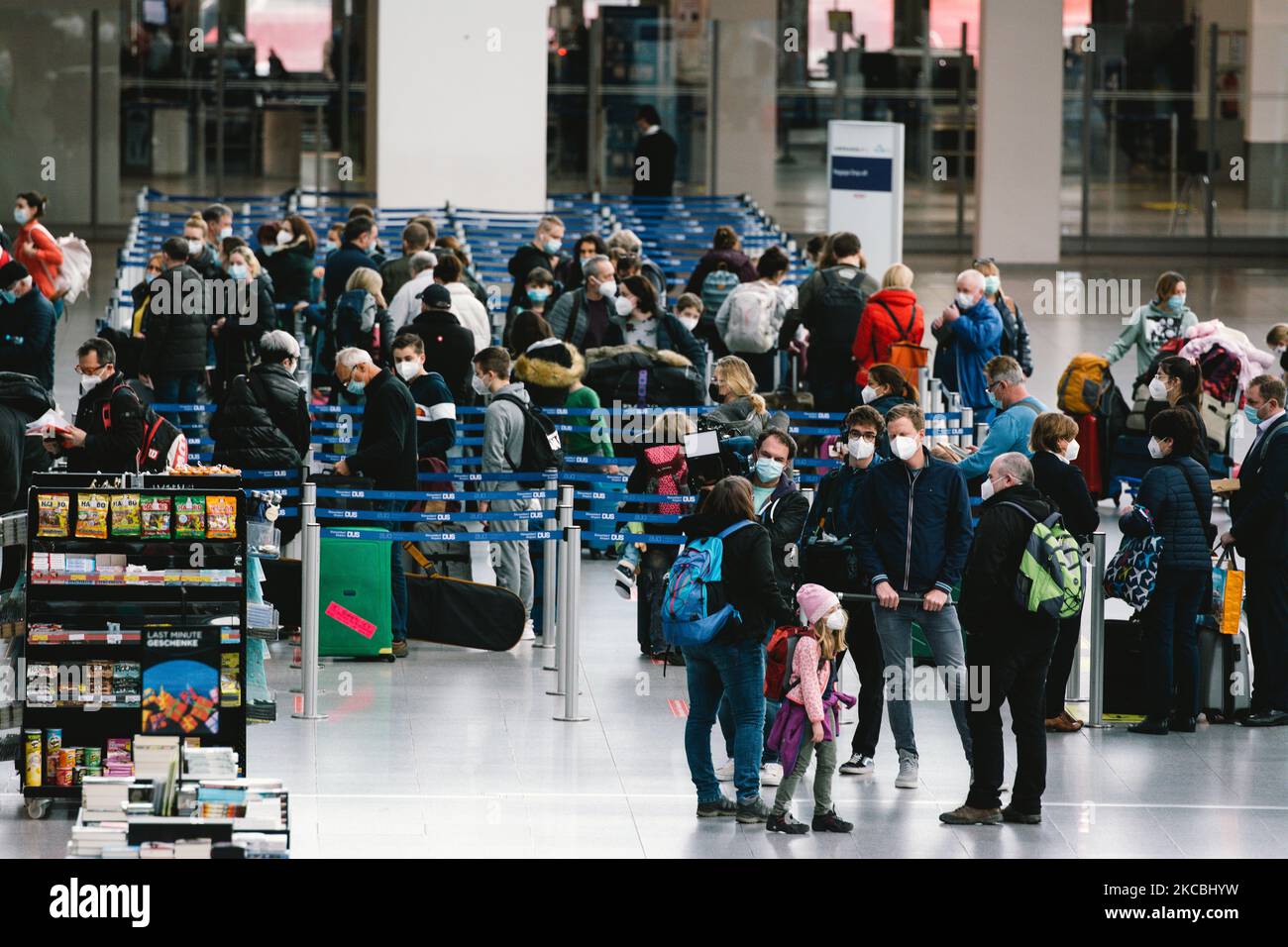 travellers wait in front of Condor check in counter at Duessedorf ...