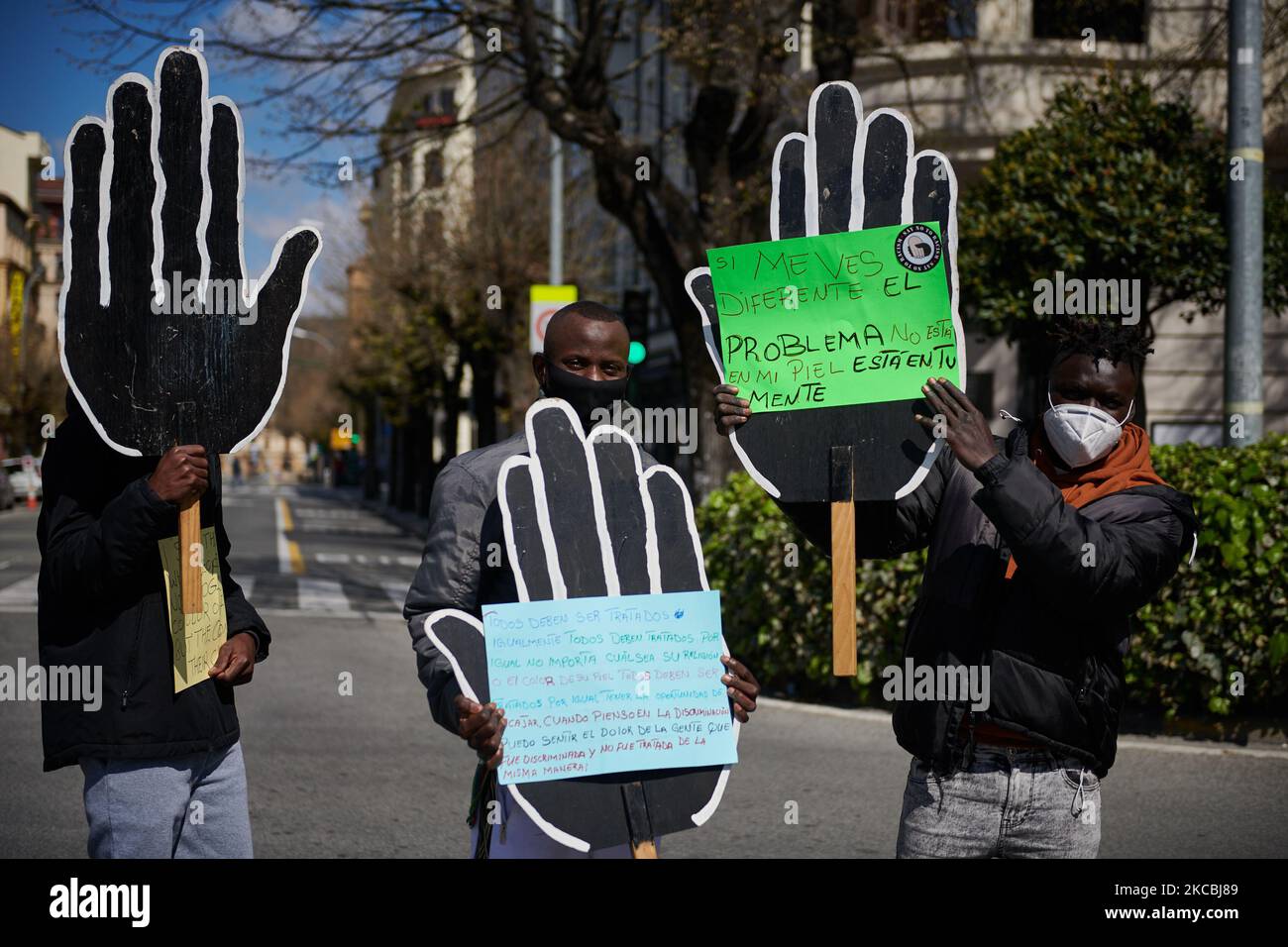 People take part in a demonstration against the racism, in Pamplona ...