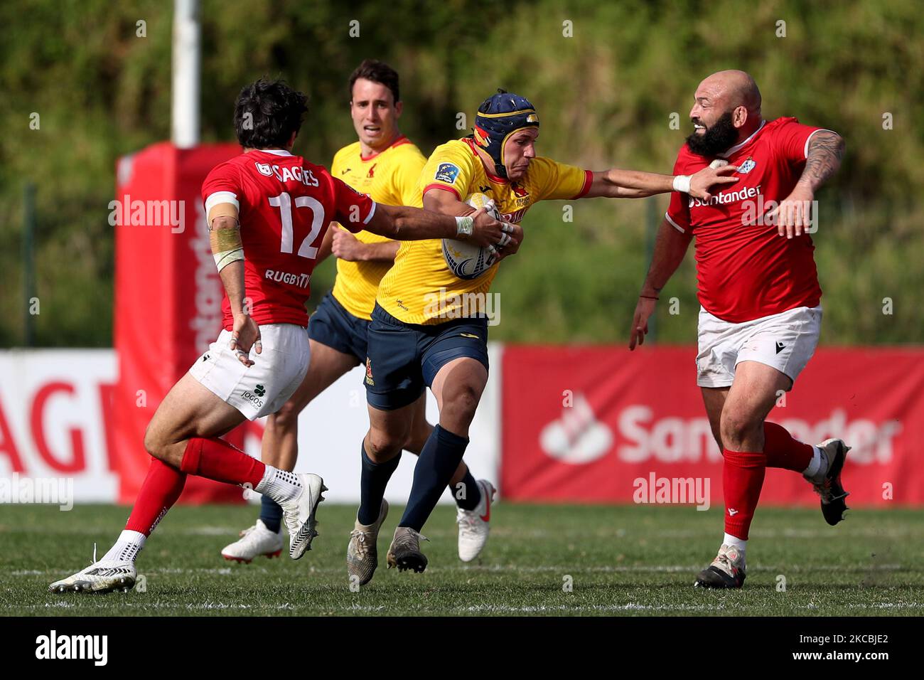 Alvar Gimeno of Spain (C ) vies with Mike Tadjer (R ) and Tomas ...