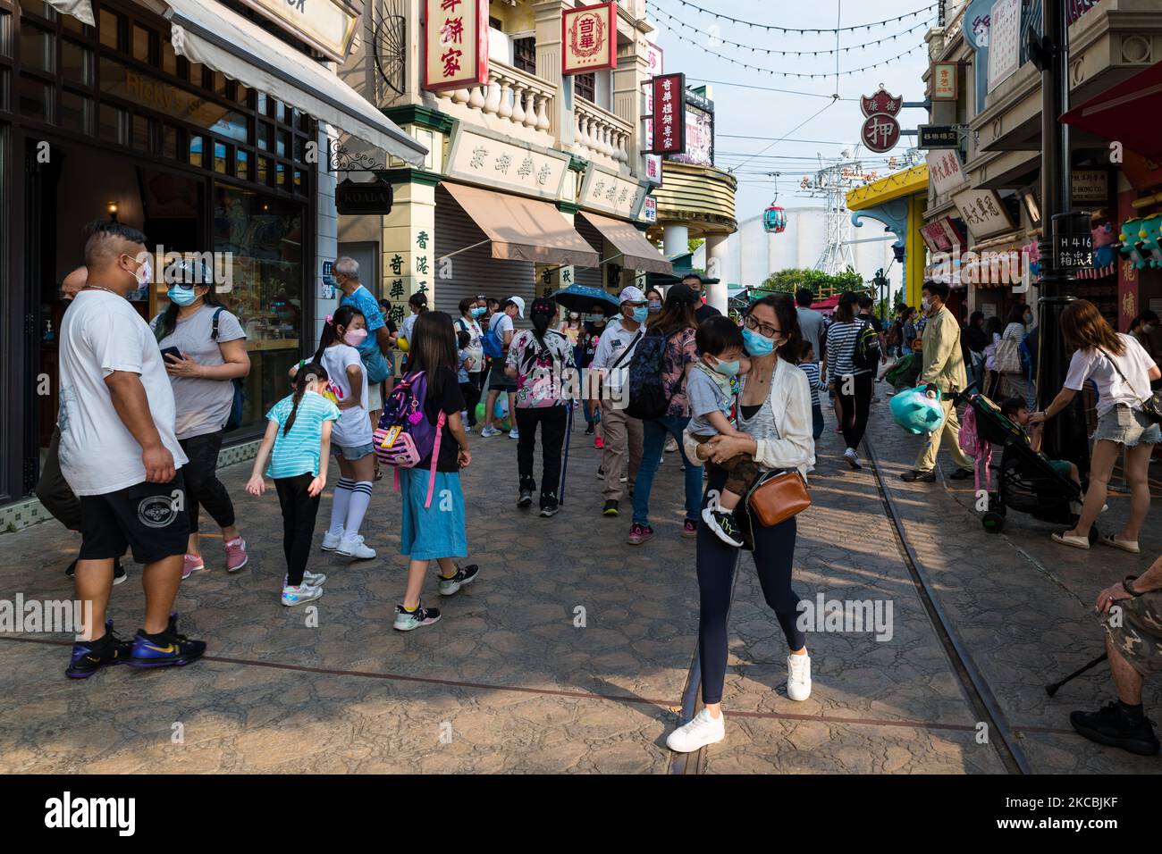 Visitors fill up one of the alleys of the Ocean Park attraction park as ...