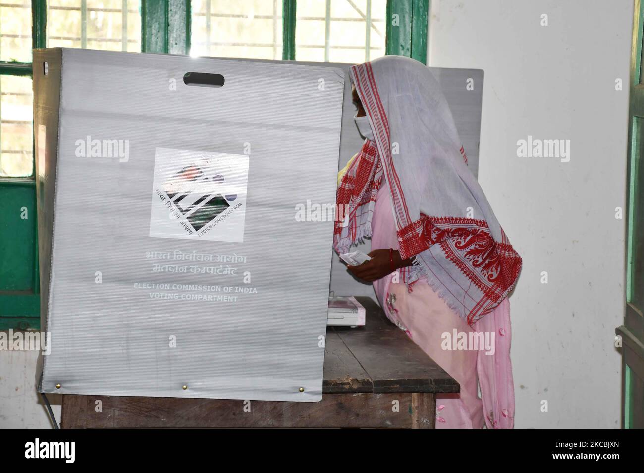 A Women voters casting ballot in the first phase of polling for Assam ...
