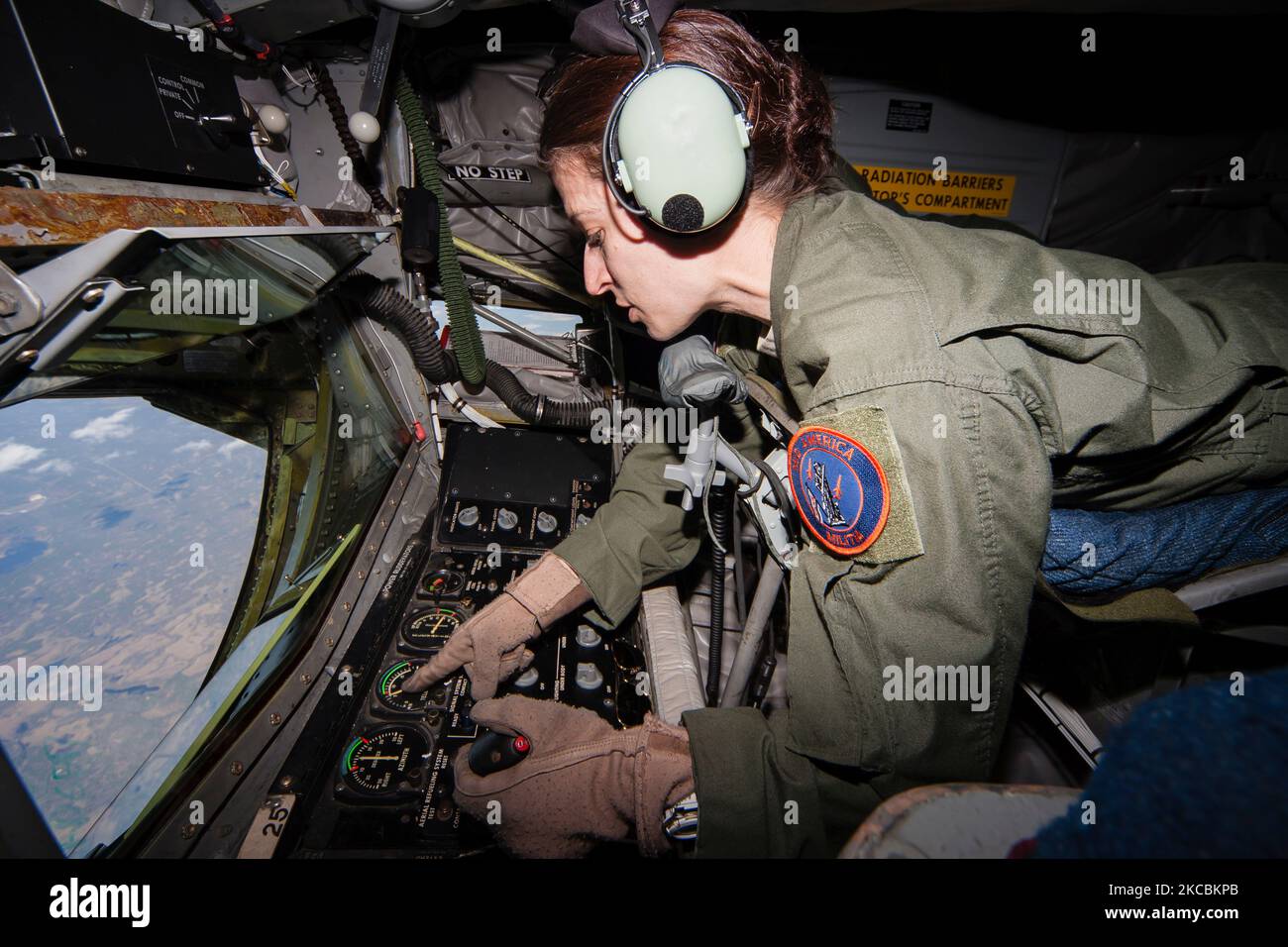 A boom operator takes her equipment through routine checks during a ...