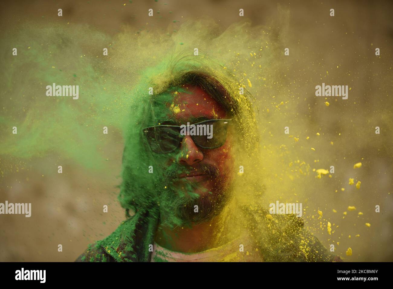 A Portrait of youth with full of colors during Holi or Fagu Purnima ...