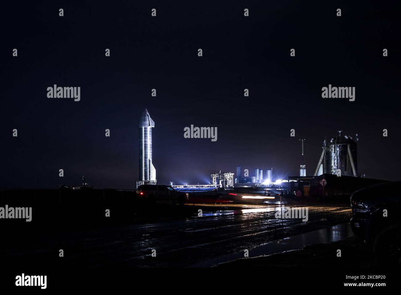 Starship SN11 is lit by spotlights late on the evening of March 28th ...
