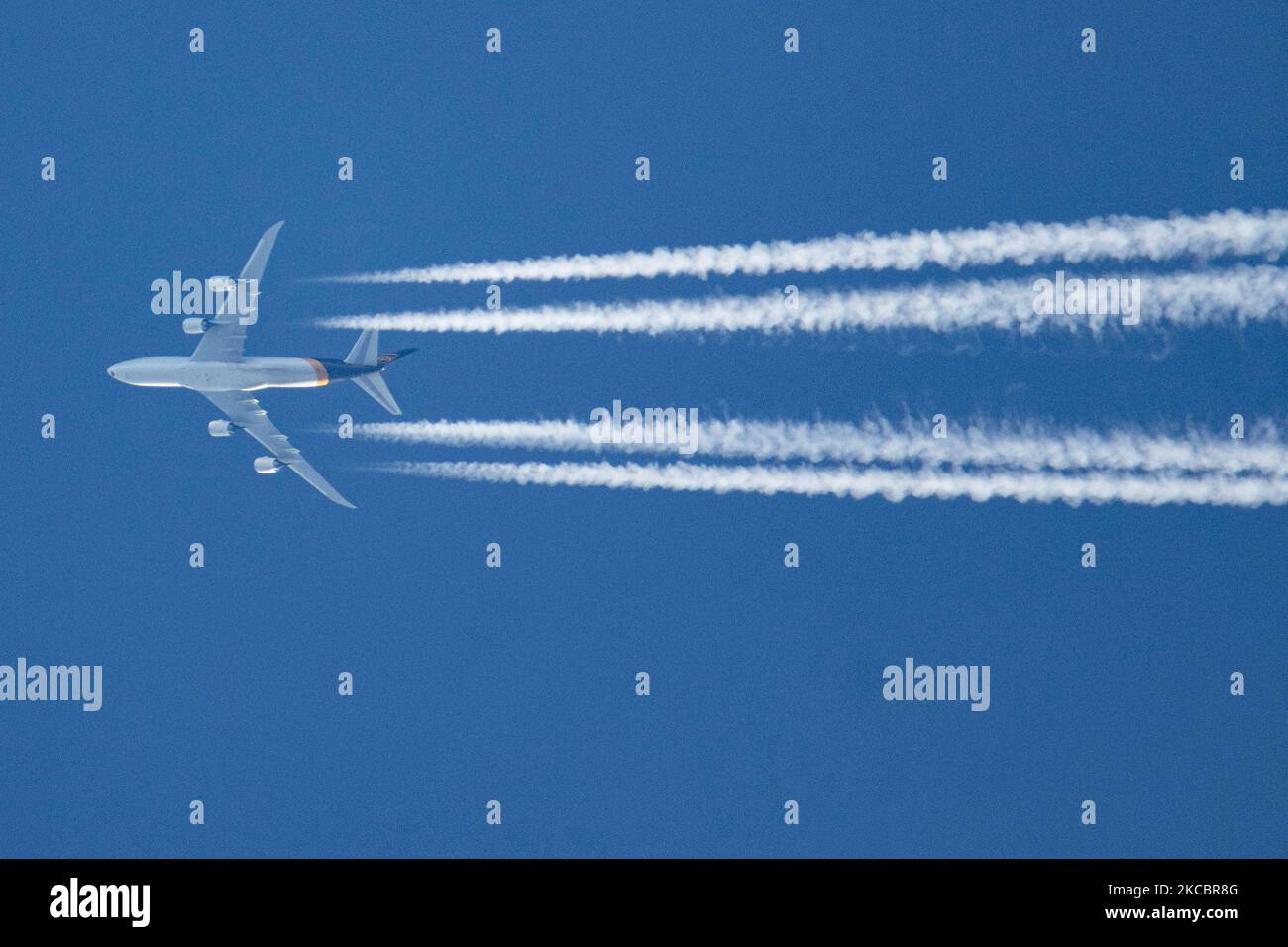 A UPS Boeing 747-8F aircraft as seen flying in the blue sky over the ...