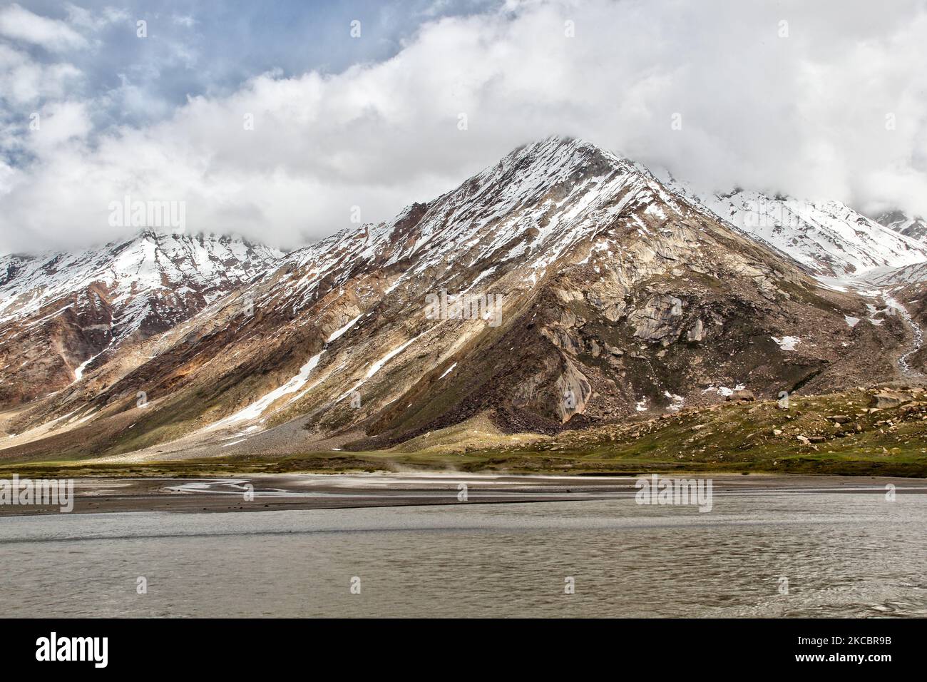 Himalayan mountains surround glacial lake in a remote valley in Zanskar ...