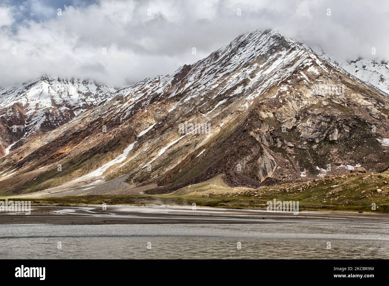 Himalayan mountains surround glacial lake in a remote valley in Zanskar ...