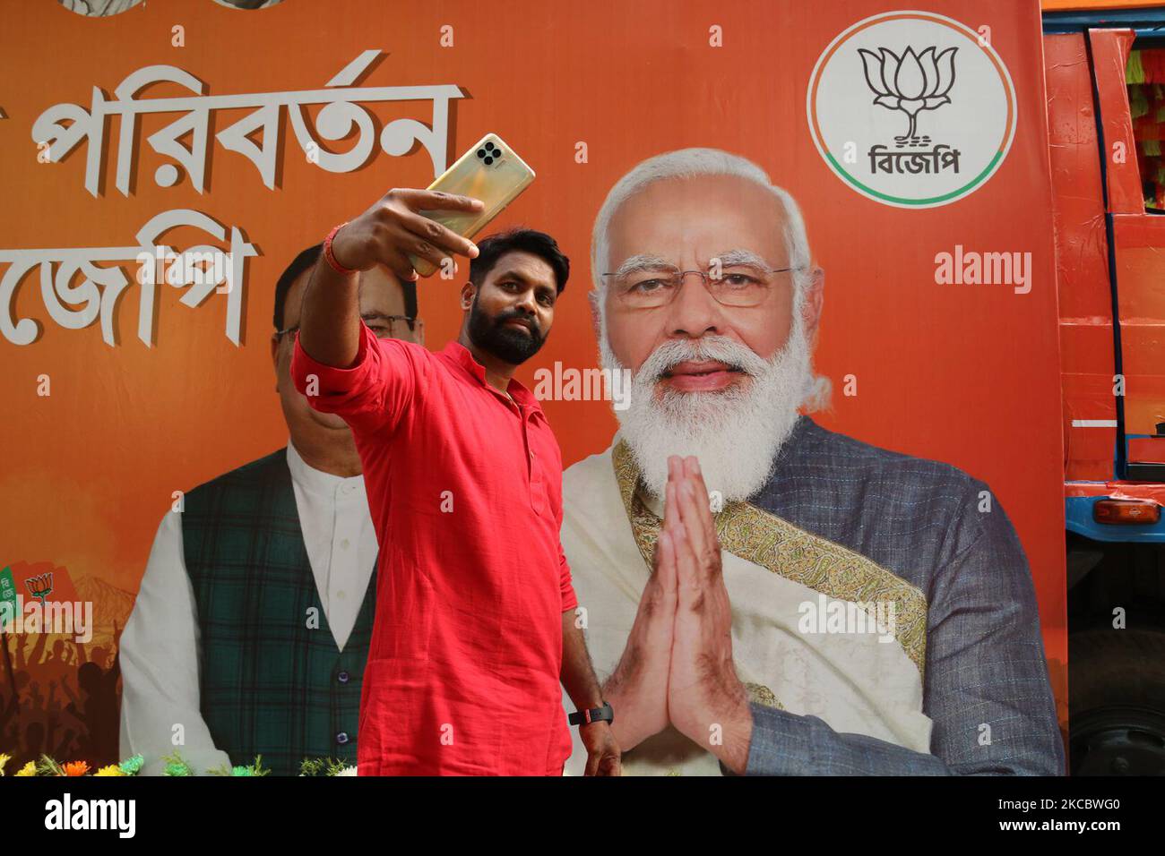 A young man his mobile camera a selfie at the front of India Prime ...