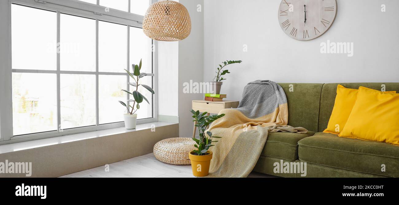 Interior of modern room with sofa near big window Stock Photo - Alamy