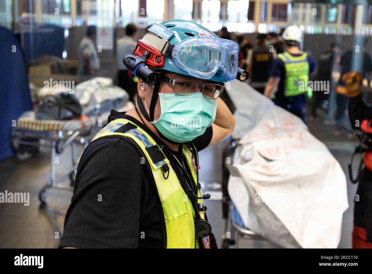 A Member of the Rescue Team bringing the first death victims of the ...