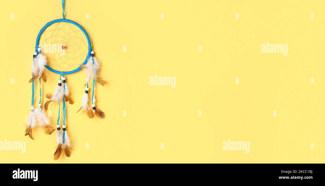 Beautiful dream catcher on yellow background with space for text Stock ...