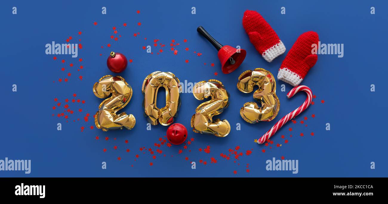 Christmas composition with figure 2023 made of balloons on blue ...
