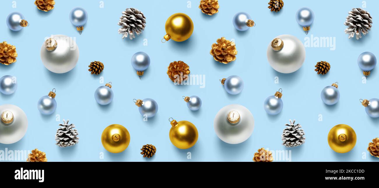 Beautiful Christmas balls and cones on light blue background. Pattern ...