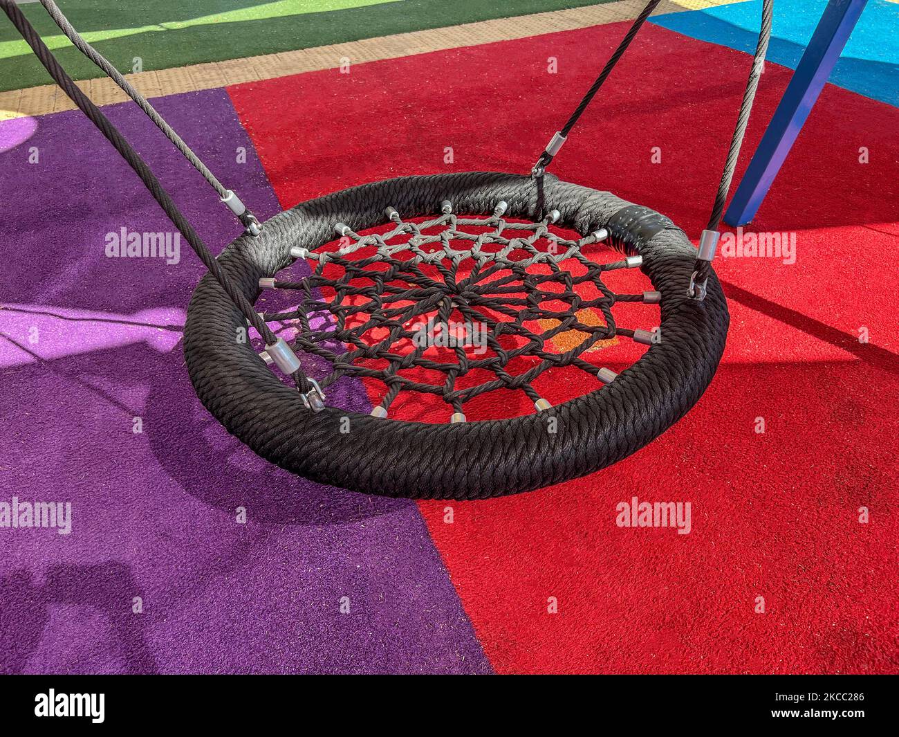 Nest swing on children's playground Stock Photo - Alamy