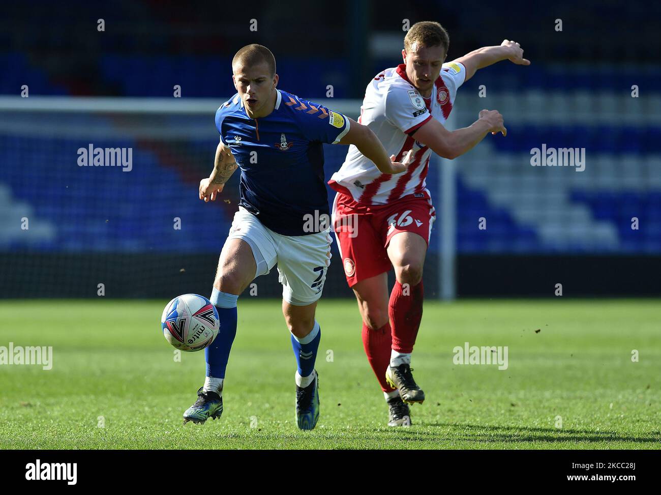 Oldham Athletic's Harry Clarke tussles with Luke Norris of Stevenage ...