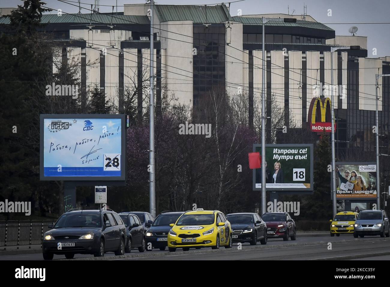 Political parties' billboards on a boulevard in front of National ...