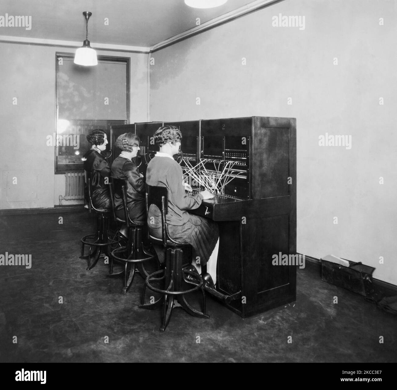 Female telephone operators seated at the switchboards in the New York ...