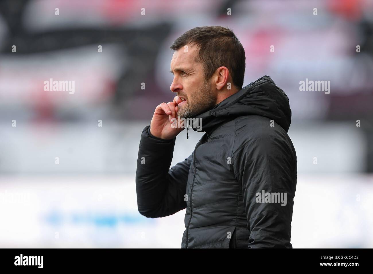 Nathan Jones, manager of Luton Town nervously biting his nails during ...